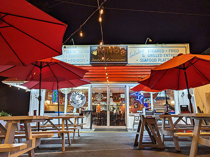 The unassuming exterior of King Neptune's hides culinary treasures within. Those red umbrellas aren't just for show&mdash;they're beacons for seafood lovers.