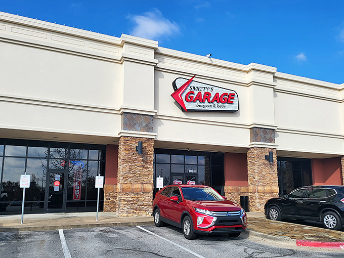 The neon-lit beacon of Smitty's Garage stands proud against the Arkansas sky, promising burger salvation to all who enter.