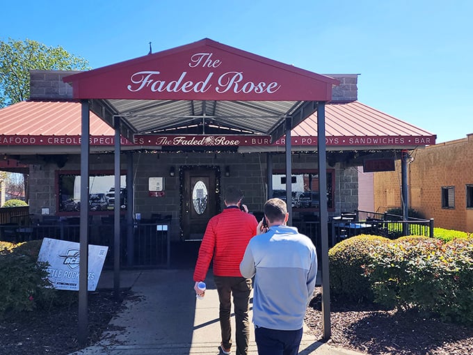 The unassuming brick exterior of The Faded Rose belies the culinary treasures within. That red awning might as well be a welcome mat to flavor town.