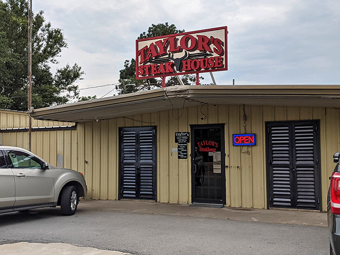 The unassuming yellow exterior of Taylor's Steakhouse stands as proof that culinary greatness often hides in plain sight.