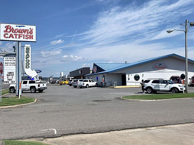 The blue-roofed temple of fried delights stands proudly against the Arkansas sky, a beacon calling hungry travelers from miles around.