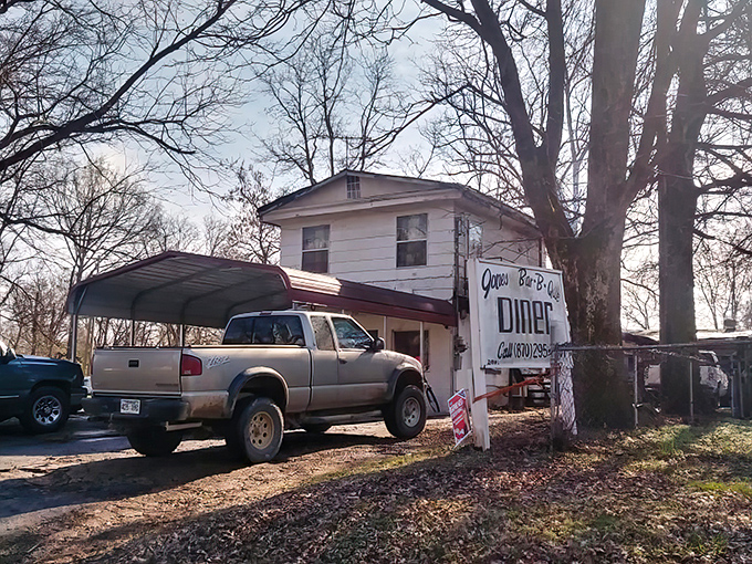 The pilgrimage begins here. This unassuming white building with its metal carport awning houses barbecue treasures that have earned national recognition and devoted followers.