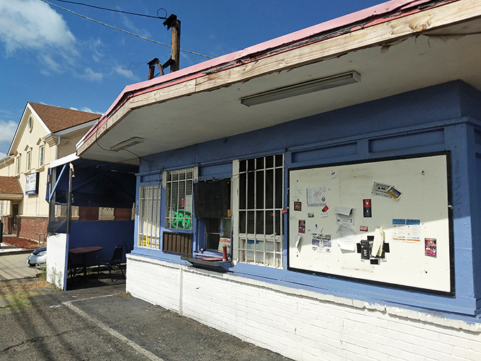 The unassuming blue exterior of Tori's Place stands like a culinary speakeasy – no fancy frills, just the promise of soul-satisfying greatness within.