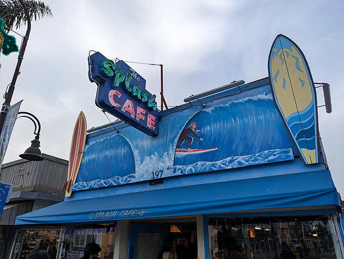 The blue-and-white facade of Splash Cafe stands like a coastal beacon, promising seafood salvation to hungry pilgrims on Pismo Beach's main drag.