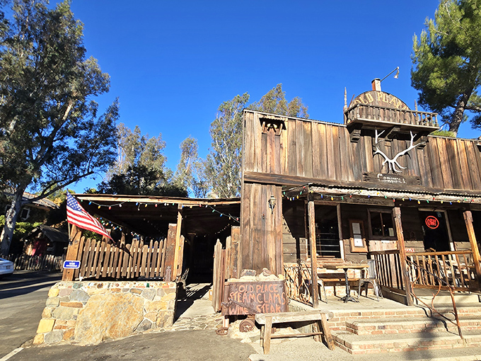 The Old Place looks like it wandered off a Western movie set and decided to serve steaks instead. Motorcycles and weathered wood tell you you're somewhere special.