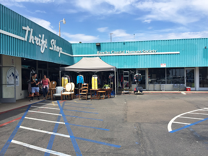 The iconic turquoise exterior of Rancho Coastal Humane Society Thrift Shop stands out like a beacon for bargain hunters under the California sun.