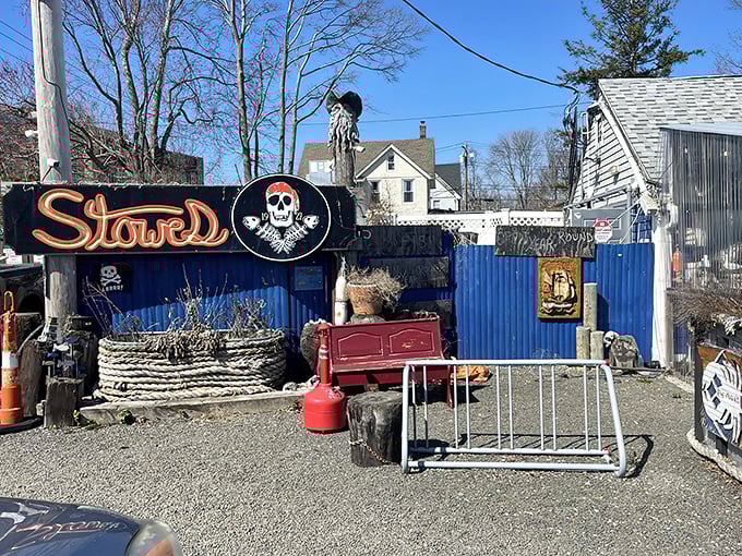 Pirate flags flutter above this unassuming seafood haven, where the American flag stands tall and wooden benches await seafood pilgrims ready for treasure.