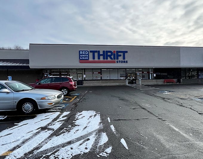 The patriotic facade of Red White & Blue Thrift Store stands proudly against a blue Connecticut sky, like a bargain-hunter's version of the Promised Land.