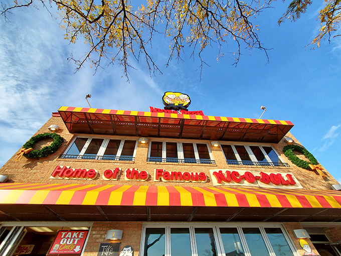The iconic red and yellow awning of Nicola Pizza stands as a beacon of comfort food in Rehoboth Beach, promising culinary treasures within those brick walls.