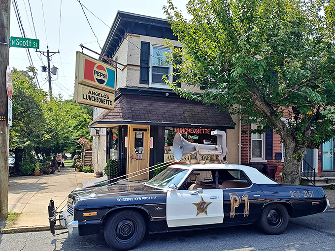 The iconic Pepsi sign beckons hungry travelers to Angelo's Luncheonette, a Wilmington institution where time stands deliciously still since 1967.