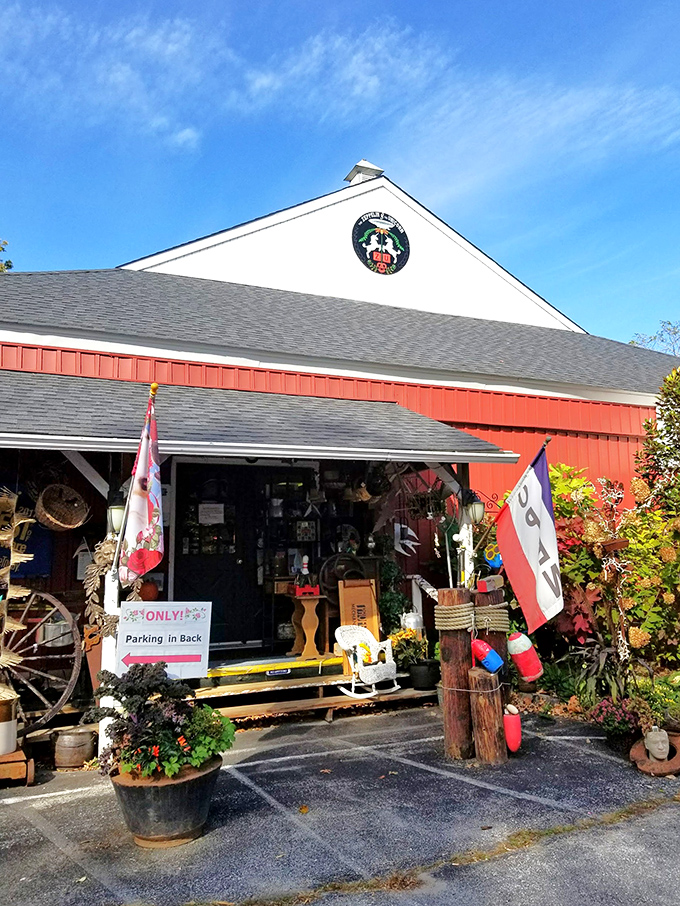 The red barn exterior of The Zeppelin and The Unicorn beckons like a portal to another time. Vibrant flowers and vintage flags hint at the treasures within.