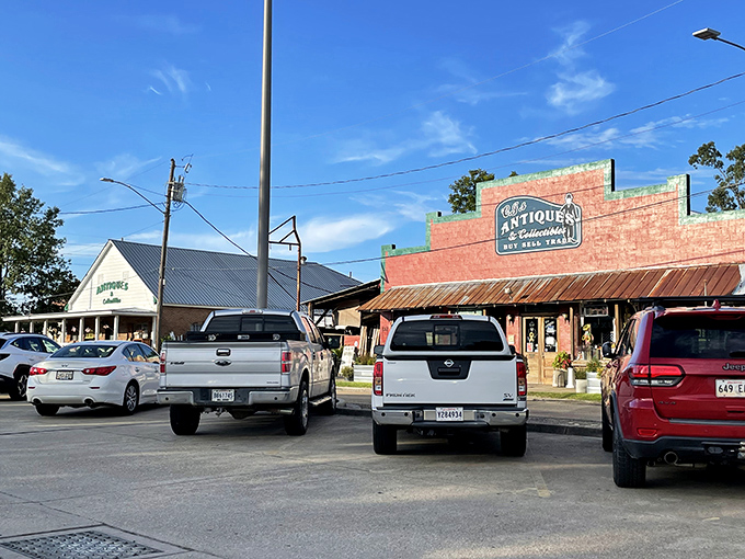 The vibrant red facade of C.J.'s Antiques & Collectibles stands out like a beacon for treasure hunters, promising adventures in nostalgia beneath that rustic metal roof.