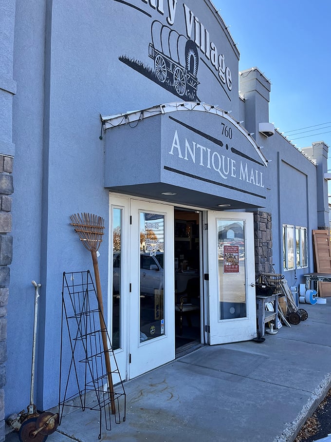The unassuming exterior of Country Village Antique Mall belies the wonderland within, like a time-travel portal disguised as a suburban building. 