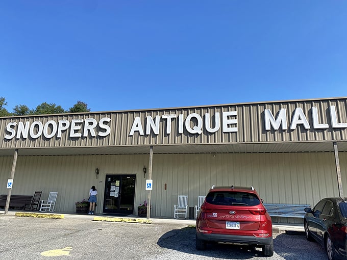 The unassuming exterior of Snoopers Antique belies the wonderland within. Like a treasure chest disguised as a toolshed, it patiently waits for curious explorers.