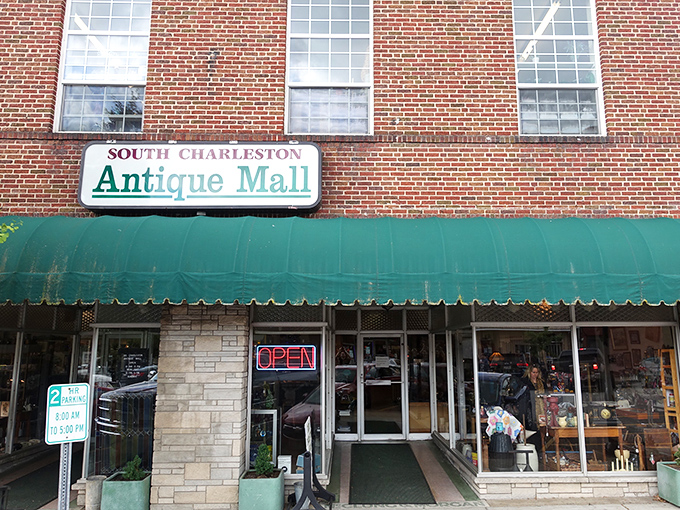Where yesterday's treasures await tomorrow's collectors." The iconic brick facade of South Charleston Antique Mall beckons with promises of discoveries beyond the green awning.