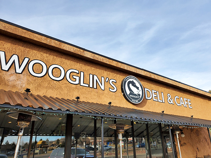 The stucco facade of Wooglin's Deli & Cafe welcomes hungry travelers with its distinctive dragon logo&mdash;a neighborhood landmark that promises comfort in sandwich form.