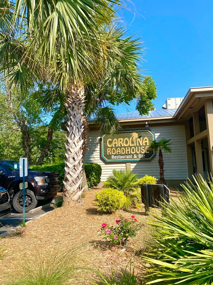The welcoming fa&ccedil;ade of Carolina Roadhouse stands ready to transform your ordinary dinner into a memorable feast under Carolina's blue skies