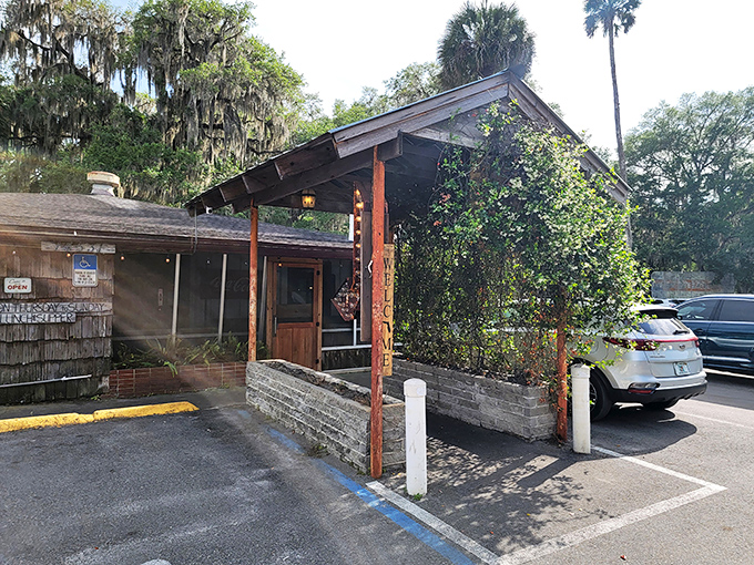The unassuming entrance to culinary paradise. Spanish moss and Florida pines stand guard over this literary landmark that's been serving authentic flavors since 1952.