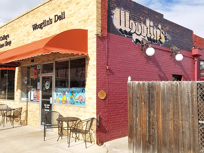 The stucco facade of Wooglin's Deli & Cafe welcomes hungry travelers with its distinctive dragon logo—a neighborhood landmark that promises comfort in sandwich form.