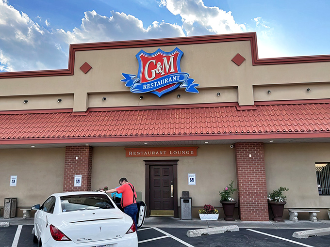 The golden glow of G & M's exterior at night isn't just lighting—it's a beacon calling all crab cake pilgrims home to their sanctuary.