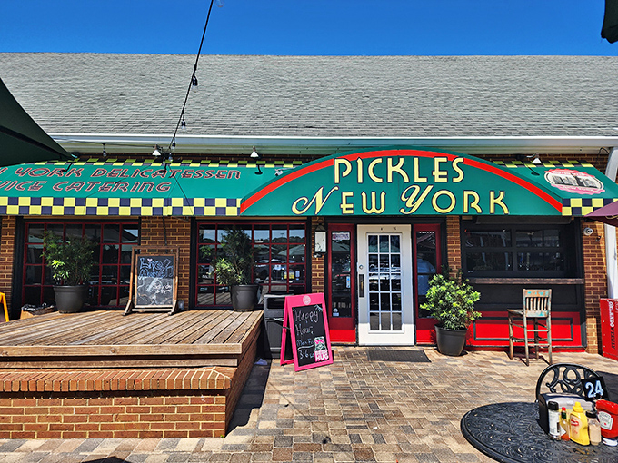 The emerald-green storefront of Pickles NY beckons like a deli oasis in the Florida suburbs. That iconic checkerboard trim promises authentic New York flavors await inside.
