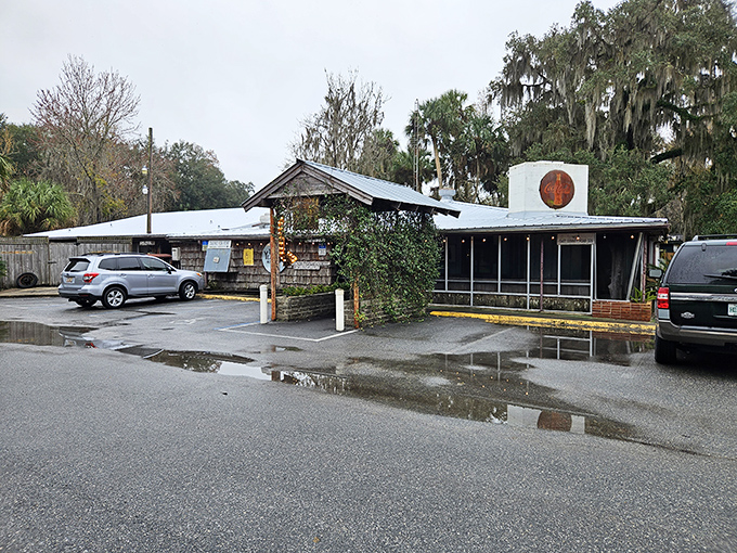 The unassuming entrance to culinary paradise. Spanish moss and Florida pines stand guard over this literary landmark that's been serving authentic flavors since 1952.