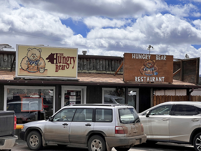 The rustic wooden exterior of Hungry Bear Restaurant stands proudly against Colorado's blue sky, promising comfort food that matches the mountain charm.