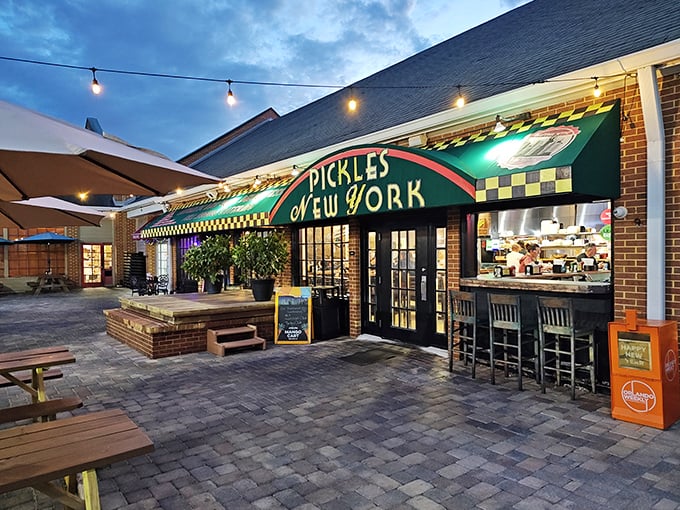 The emerald-green storefront of Pickles NY beckons like a deli oasis in the Florida suburbs. That iconic checkerboard trim promises authentic New York flavors await inside.
