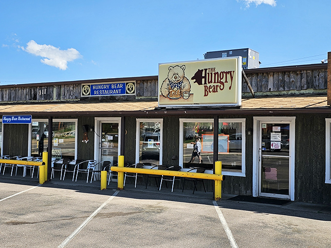 The rustic wooden exterior of Hungry Bear Restaurant stands proudly against Colorado's blue sky, promising comfort food that matches the mountain charm.