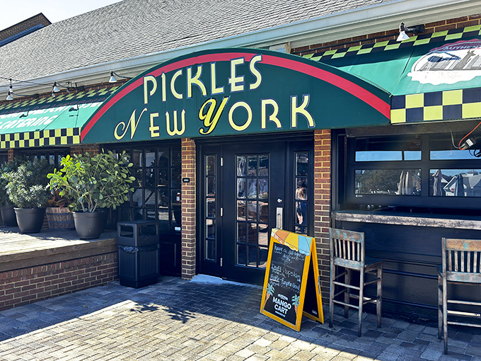 The emerald-green storefront of Pickles NY beckons like a deli oasis in the Florida suburbs. That iconic checkerboard trim promises authentic New York flavors await inside.
