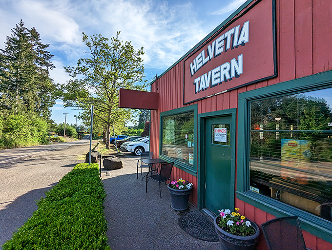 The red farmhouse-style building stands proudly against Oregon's blue sky, like a burger beacon calling hungry travelers home.