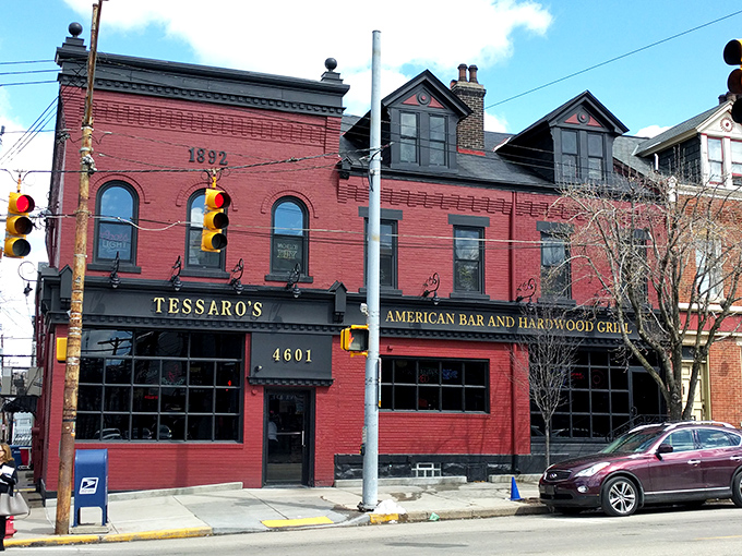 The unassuming pink brick exterior of Tessaro's hides culinary greatness like a superhero's secret identity. Pittsburgh's burger temple awaits. 