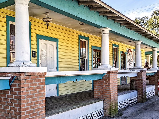 The yellow bungalow with turquoise trim stands like a barbecue beacon in Tampa, promising smoky treasures within its humble walls.