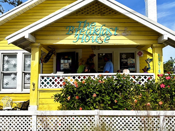 The cheerful yellow cottage with its white picket fence isn't just Instagram-worthy—it's a beacon of breakfast hope in Sarasota's Gillespie Park neighborhood.