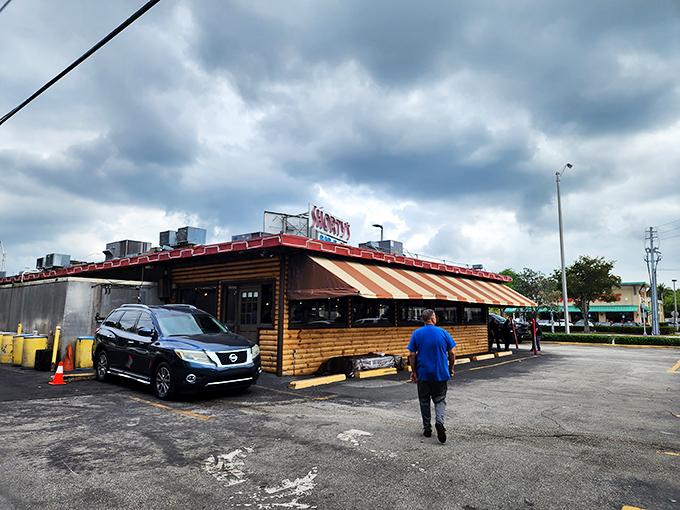 The iconic red and white striped awning of Shorty's has been Miami's smoke signal to barbecue lovers since 1951. A landmark that's survived hurricanes, fires, and food trends.