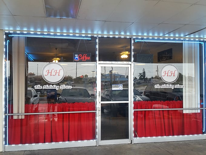 The iconic red curtains and "HH" logo welcome hungry travelers like a beacon of comfort food hope in Holiday, Florida.