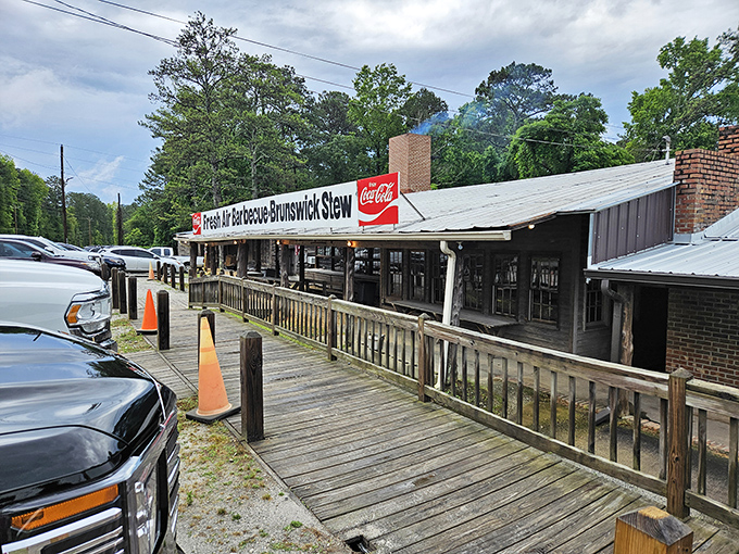 The humble exterior of Fresh Air BBQ stands as a testament that greatness doesn't need fancy packaging—just smoke, tradition, and a gravel parking lot.