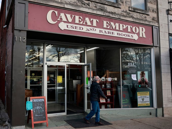 The storefront of Caveat Emptor beckons like a literary siren song. Latin for "buyer beware," but the only danger here is losing track of time.