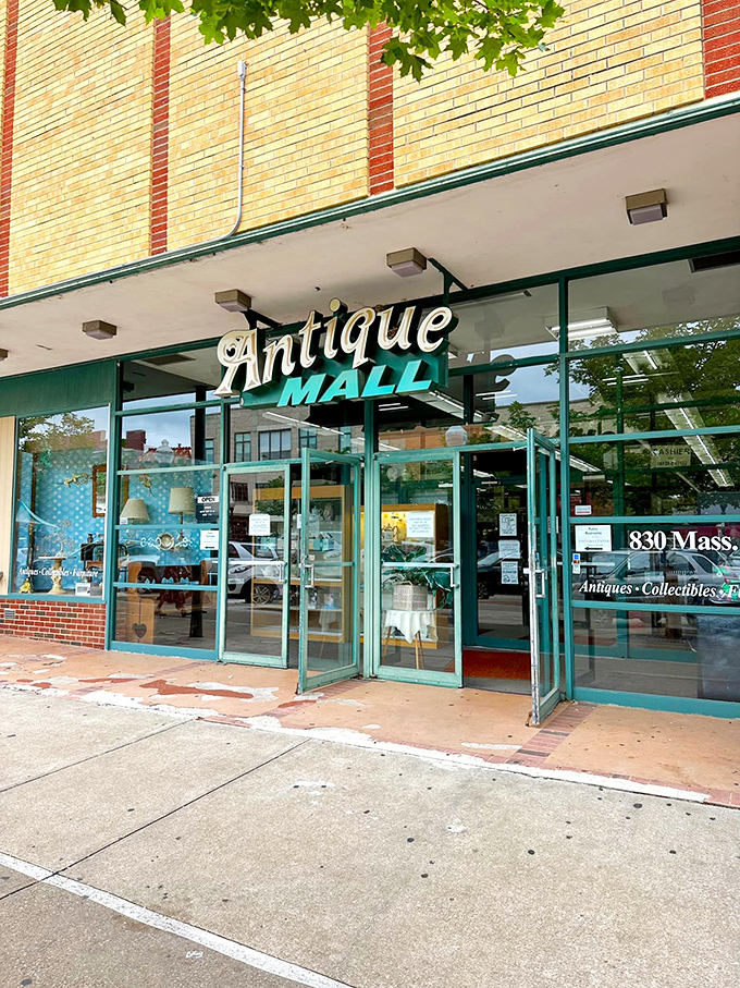 The vintage "Antique Mall" sign beckons like an old friend, promising treasures behind those glass doors on Massachusetts Street.