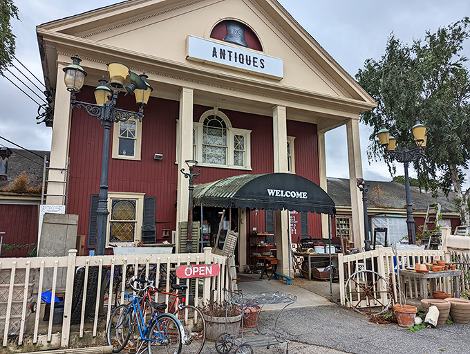 A New England time portal disguised as a charming red building with white trim. Cape Cod's architectural equivalent of "come on in, we've got stories to tell." 