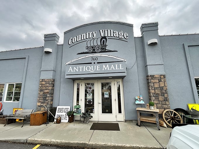 The unassuming exterior of Country Village Antique Mall belies the wonderland within, like a time-travel portal disguised as a suburban building.