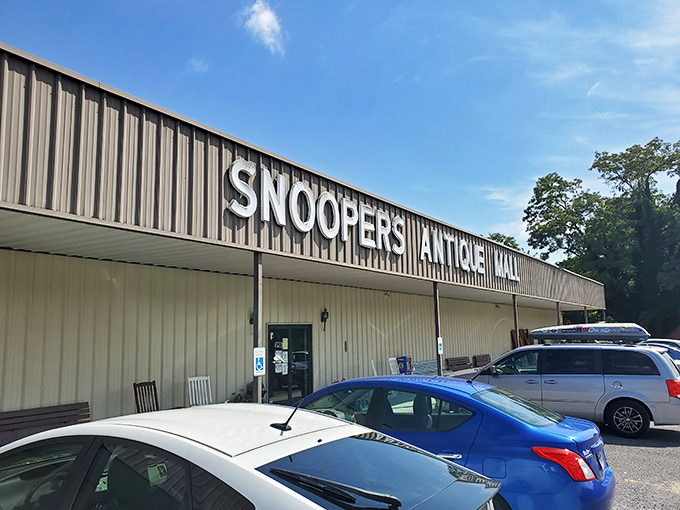 The unassuming exterior of Snoopers Antique belies the wonderland within. Like a treasure chest disguised as a toolshed, it patiently waits for curious explorers.