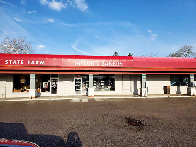 The iconic red awning of Taylor's Bakery stands as a beacon of sweetness in Indianapolis, promising delectable treasures within its unassuming exterior.