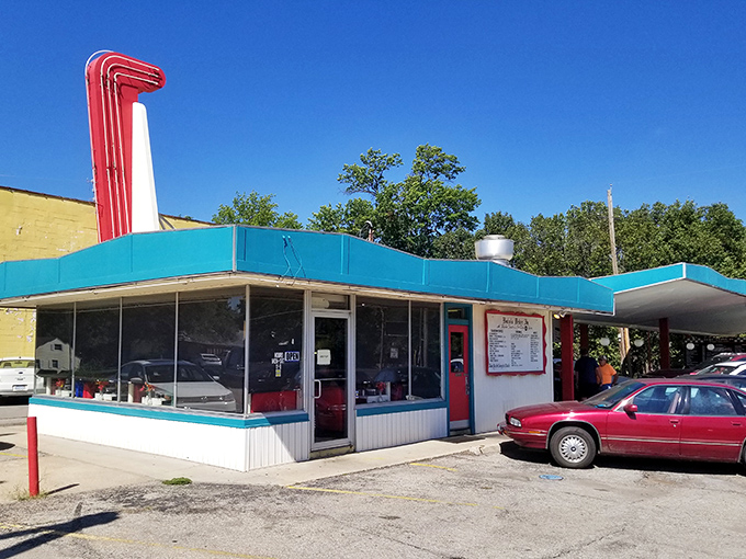 The white exterior of Bobo's stands like a beacon of mid-century nostalgia, promising comfort food that's remained unchanged since Eisenhower was in office.