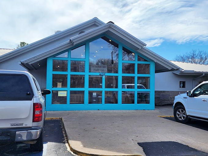 The teal-framed A-frame entrance isn't just inviting&mdash;it's practically winking at you to come inside for a catfish adventure.