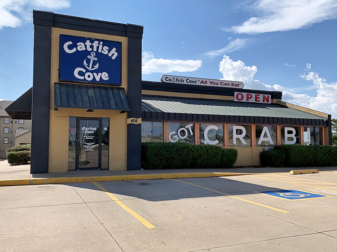 The blue and tan exterior of Catfish Cove stands like a seafood oasis in landlocked Oklahoma, boldly proclaiming "GOT CRAB" to passing motorists.