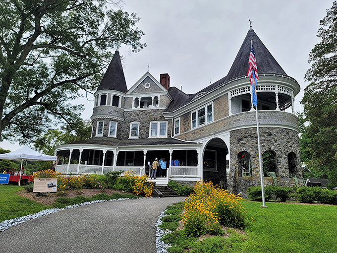 Auburn Heights mansion stands like a Victorian dream, its turret and wrap-around porch whispering tales of Gilded Age splendor and steam-powered adventures.