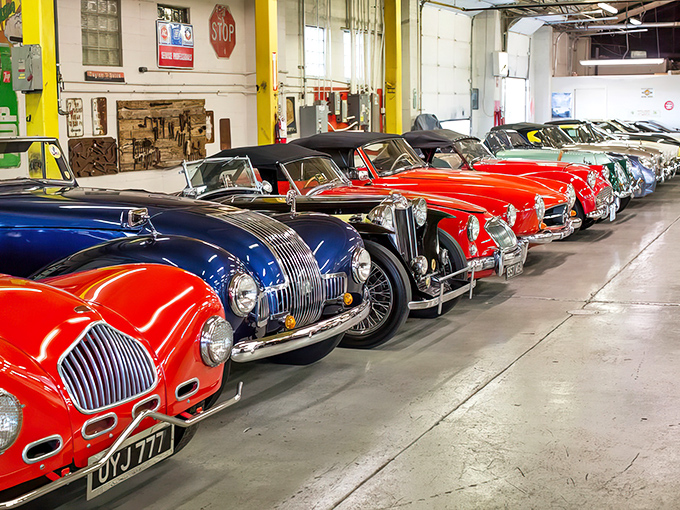 The classic checkered flag meets sunshine yellow on this roadside gem. A fitting beacon for automotive aficionados traveling along the Mother Road. 