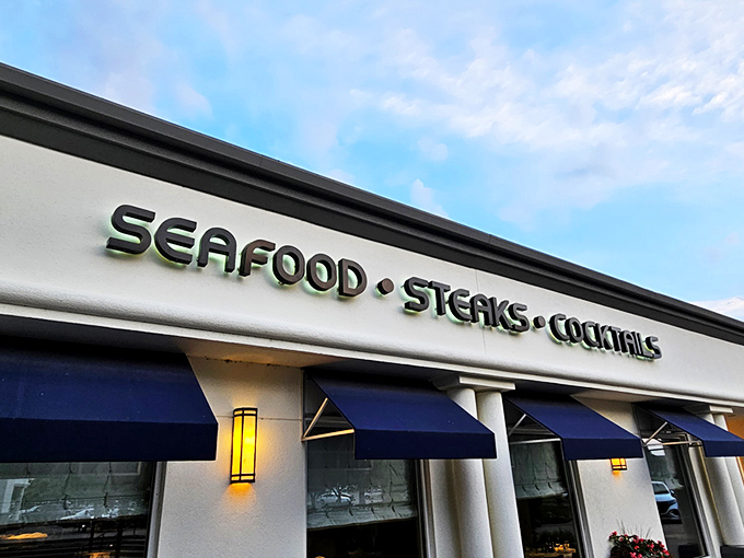 Newport Grill's exterior welcomes you with cheerful blue umbrellas and a sunny patio&mdash;like the Mediterranean coast decided to vacation in Kansas.