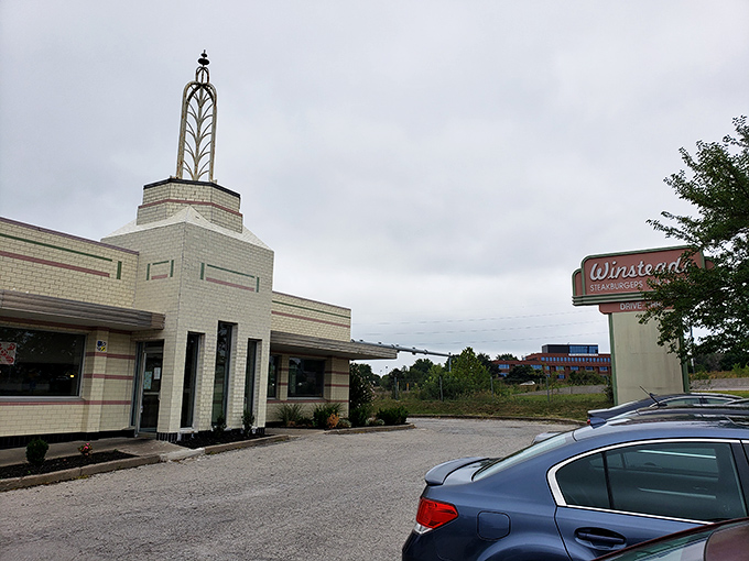 The iconic Art Deco exterior of Winstead's stands as a time capsule of mid-century design, complete with that unmistakable spire reaching skyward.